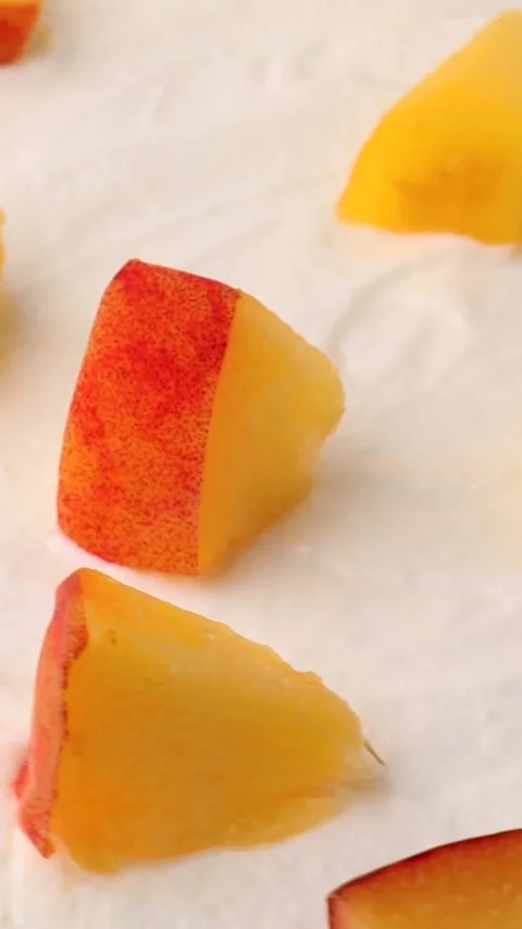 Fresh cut peach slices in cottage cheese... | Stock Video | Pond5