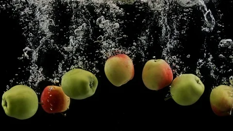 Fresh fruits colorful apples falling wat... | Stock Video | Pond5