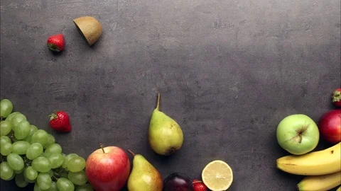 Fresh fruits moving on kitchen table bac... | Stock Video | Pond5
