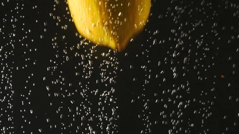 Fresh lemon falling into the water with ... | Stock Video | Pond5