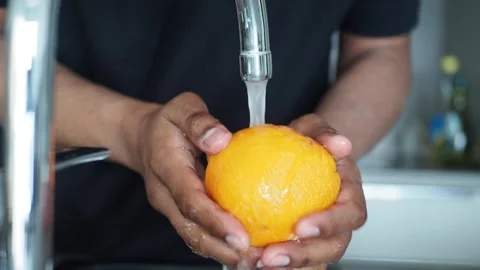 fresh orange fruit washing with tap wate... | Stock Video | Pond5