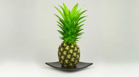 Fresh pineapple rotation on a white back... | Stock Video | Pond5