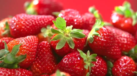 Fresh ripe strawberry over red. Food fra... | Stock Video | Pond5