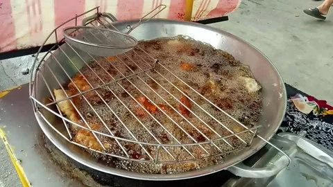 Fried chicken at a street food cart | Stock Video | Pond5