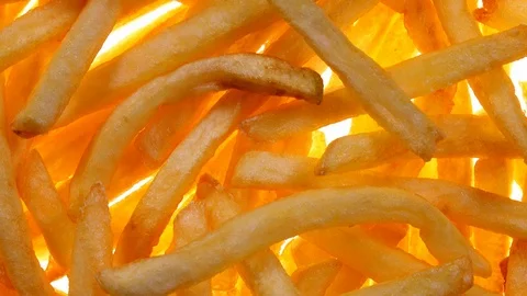 Fried potato chips rotating on white bac... | Stock Video | Pond5