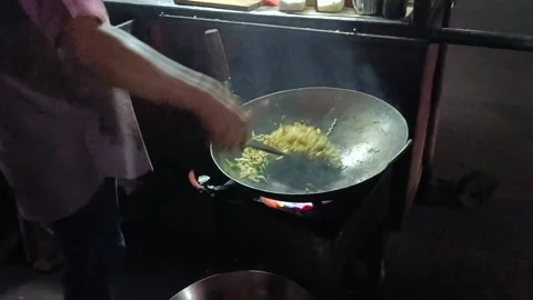 fried rice seller is sauteing his food b... | Stock Video | Pond5