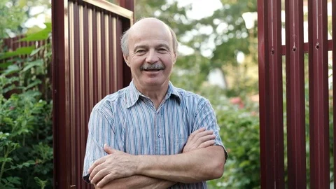 Friendly caucasian old man waving hi or ... | Stock Video | Pond5