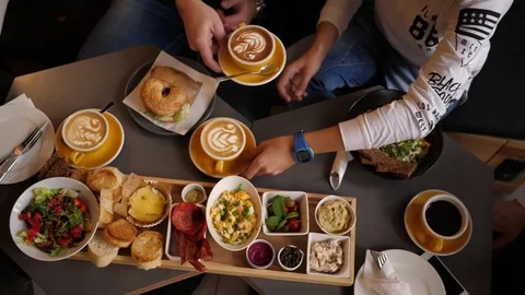 Friends breakfast eating in snack bar - ... | Stock Video | Pond5