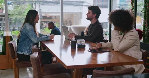 Friends chatting at coffee shop interior... | Stock Video | Pond5