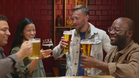 Friends Hanging out in Bar and Giving To... | Stock Video | Pond5