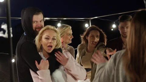 friends sing and dances on beach party o... | Stock Video | Pond5