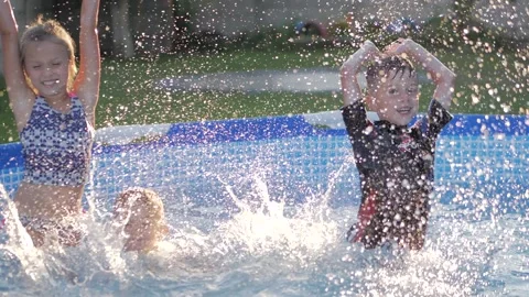 friends splashing in pool together on su... | Stock Video | Pond5