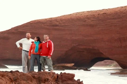 Friends standing on the rocks on beautif... | Stock Video | Pond5
