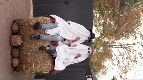 Friends in white sheet ghost costumes, H... | Stock Video | Pond5