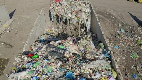 Front loader loading waste on the heap w... | Stock Video | Pond5