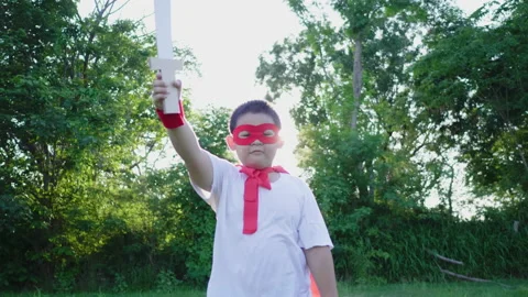 Front view of boy point sword up to the ... | Stock Video | Pond5