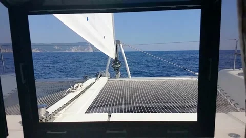 Front view of catamaran zooming out thro... | Stock Video | Pond5
