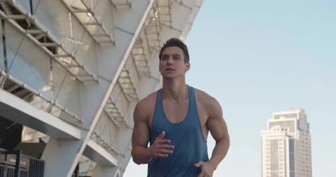 Front view of handsome sport man running... | Stock Video | Pond5