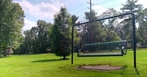 Front view of Hanging bench rocking chai... | Stock Video | Pond5