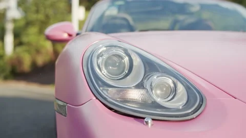 Front view of headlights of pink coated ... | Stock Video | Pond5