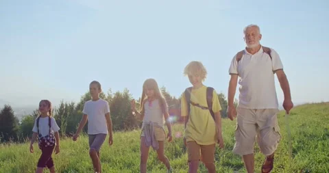 Front view of kids walking, going in row... | Stock Video | Pond5