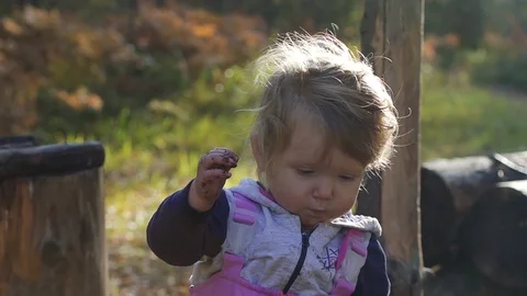 Front view of little girl walking and wa... | Stock Video | Pond5