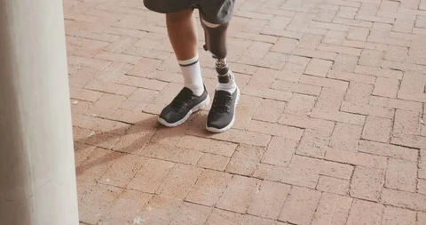 Front view man with prosthetic leg stret... | Stock Video | Pond5