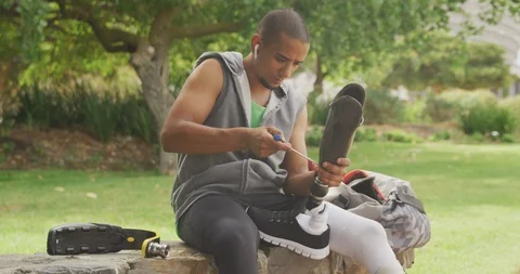Front view man readjusting his prostheti... | Stock Video | Pond5