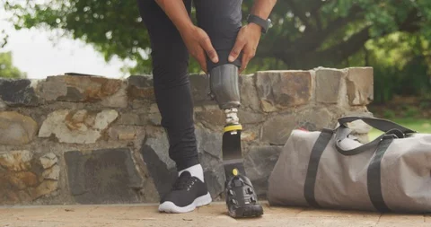Front view man readjusting his prostheti... | Stock Video | Pond5