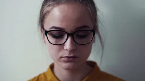 A front view portrait of young sad girl ... | Stock Video | Pond5