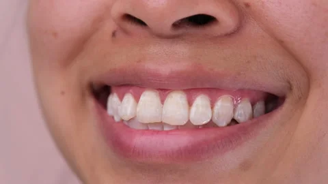 Front view of smiling Asian woman reveal... | Stock Video | Pond5