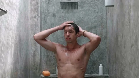 Front view Young Man Washing and Taking ... | Stock Video | Pond5