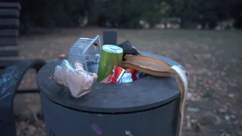 Frontal shot of trash garbage can overfl... | Stock Video | Pond5