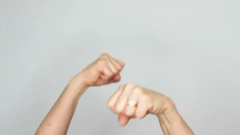 A frontal view of spinning her two hands... | Stock Video | Pond5