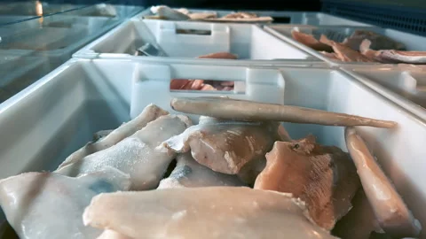 Frozen ocean fish fillets piled up in re... | Stock Video | Pond5