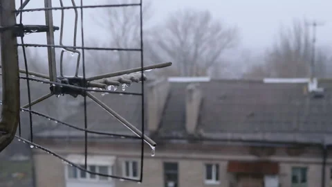Frozen Raindrops on Grating of a Televis... | Stock Video | Pond5