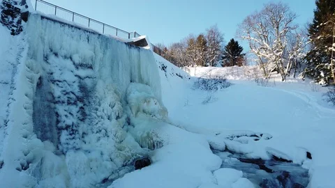 Frozen waterfall over dam. | Stock Video | Pond5