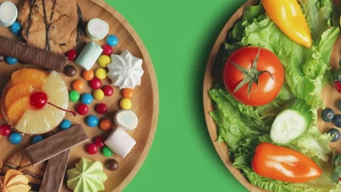 Fruits and vegetables vs candy sweets an... | Stock Video | Pond5