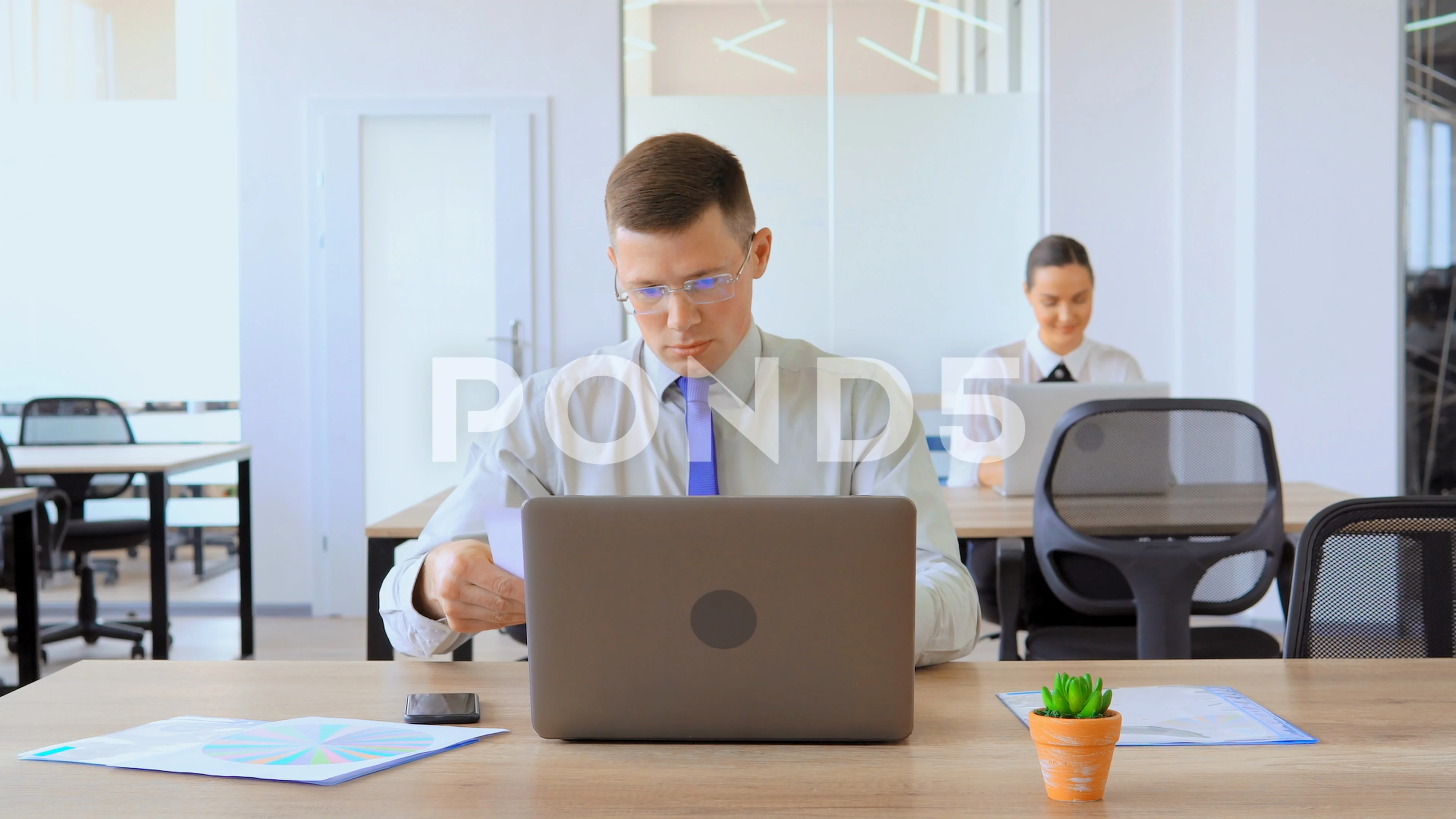 Frustrated Office Worker At Desk