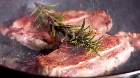 Fry meat beef with thyme and Rosemary Ba... | Stock Video | Pond5