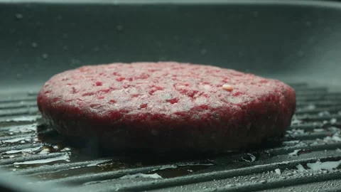 Frying minced meat patty for a burger. | Stock Video | Pond5