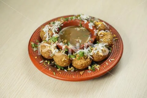 Fuchka or pani puri and gol gappay with sour water, served in dish ...