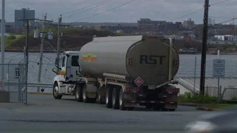 Fuel tanker truck drive down the road an... | Stock Video | Pond5