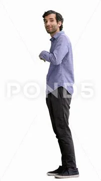 Full-length portrait of a young man. standing isolated on white ...