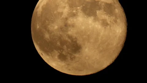 Full moon close up. Yellow moon in the n... | Stock Video | Pond5