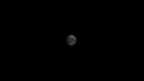 Full moon disappearing in the clouds at ... | Stock Video | Pond5