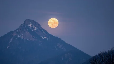 Full moon fall down over forest mountain... | Stock Video | Pond5