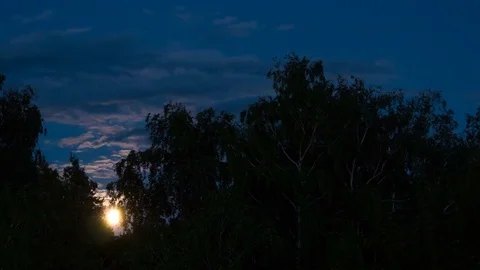 Full Moon Moves in the Night Sky through... | Stock Video | Pond5