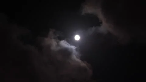 Full Moon Moves in the Night Sky through... | Stock Video | Pond5