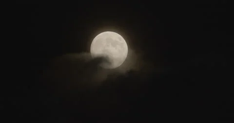 Full moon moves through the night sky, a... | Stock Video | Pond5